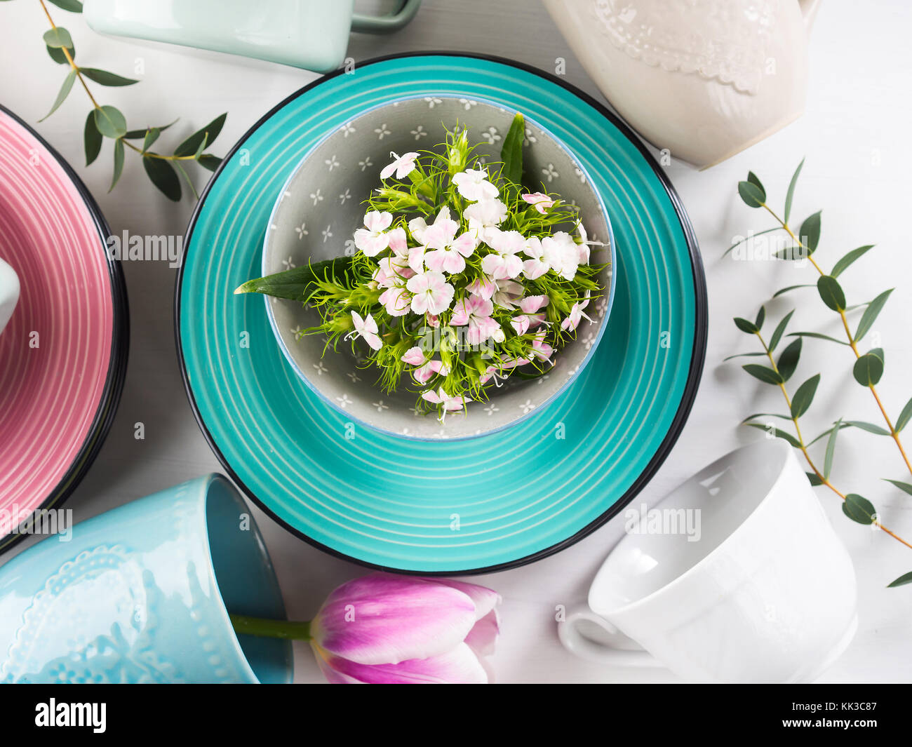 Spring tableware crockery concept with tulips flowers pastel color ...