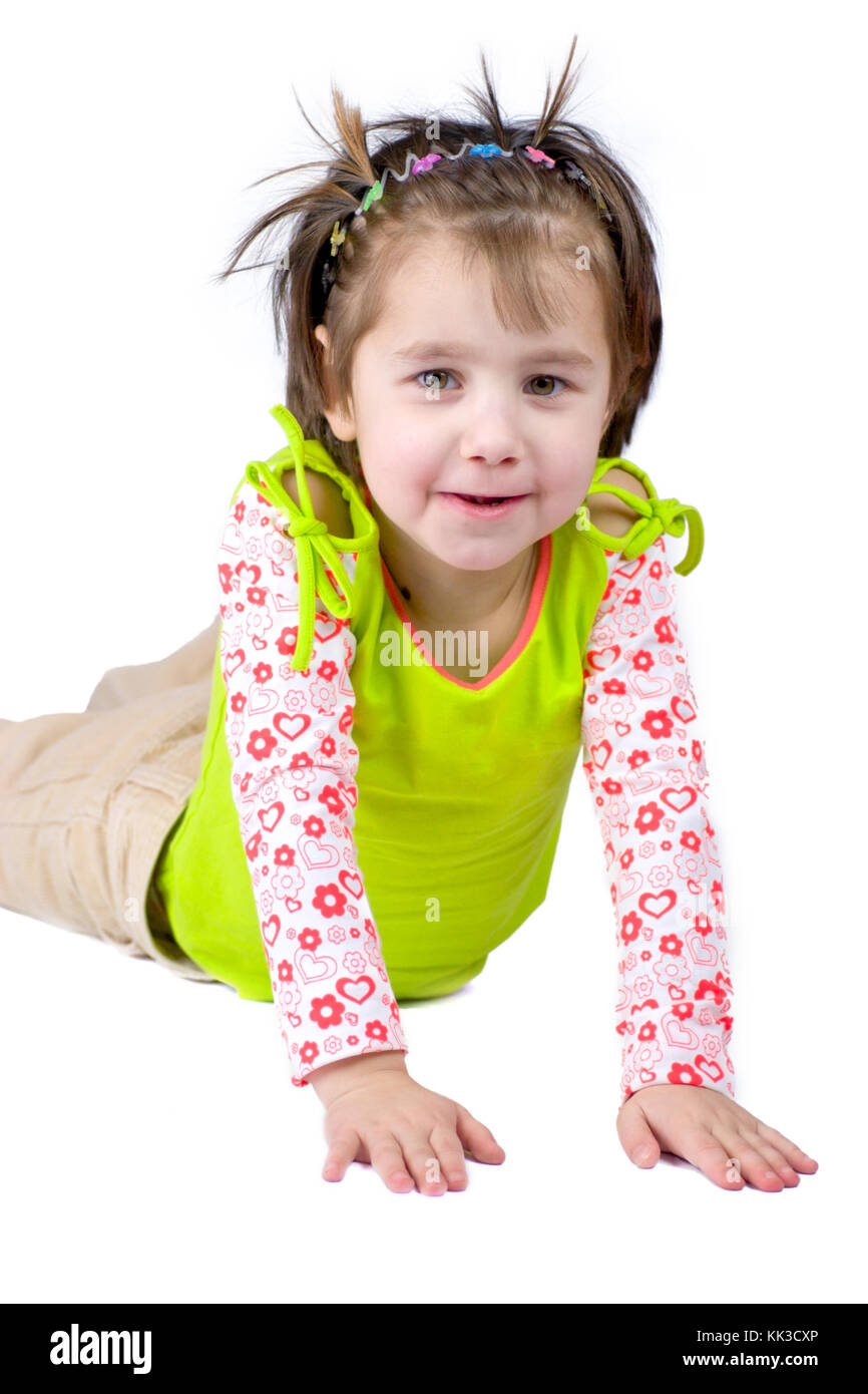 Five years girl with funny face sitting on the floor isolated on white ...