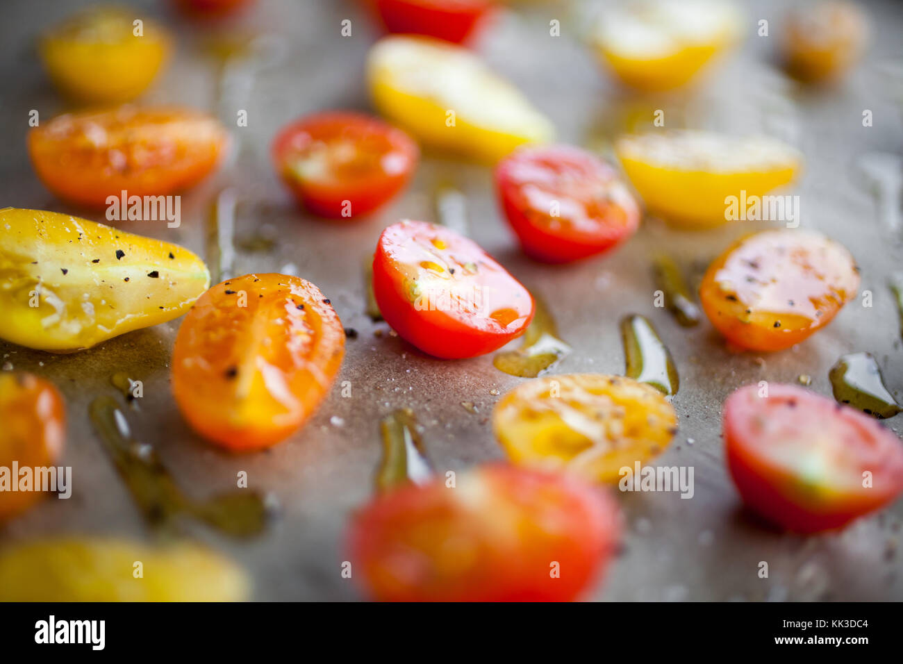 Making half dried tomatoes from colorful tomatoes Stock Photo - Alamy