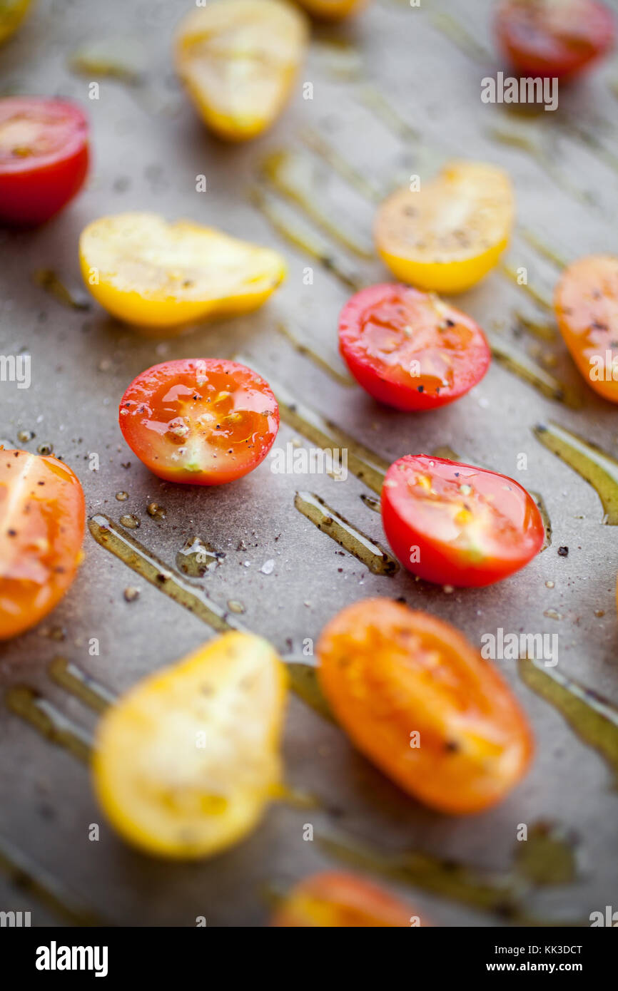 Making half dried tomatoes from colorful tomatoes Stock Photo - Alamy