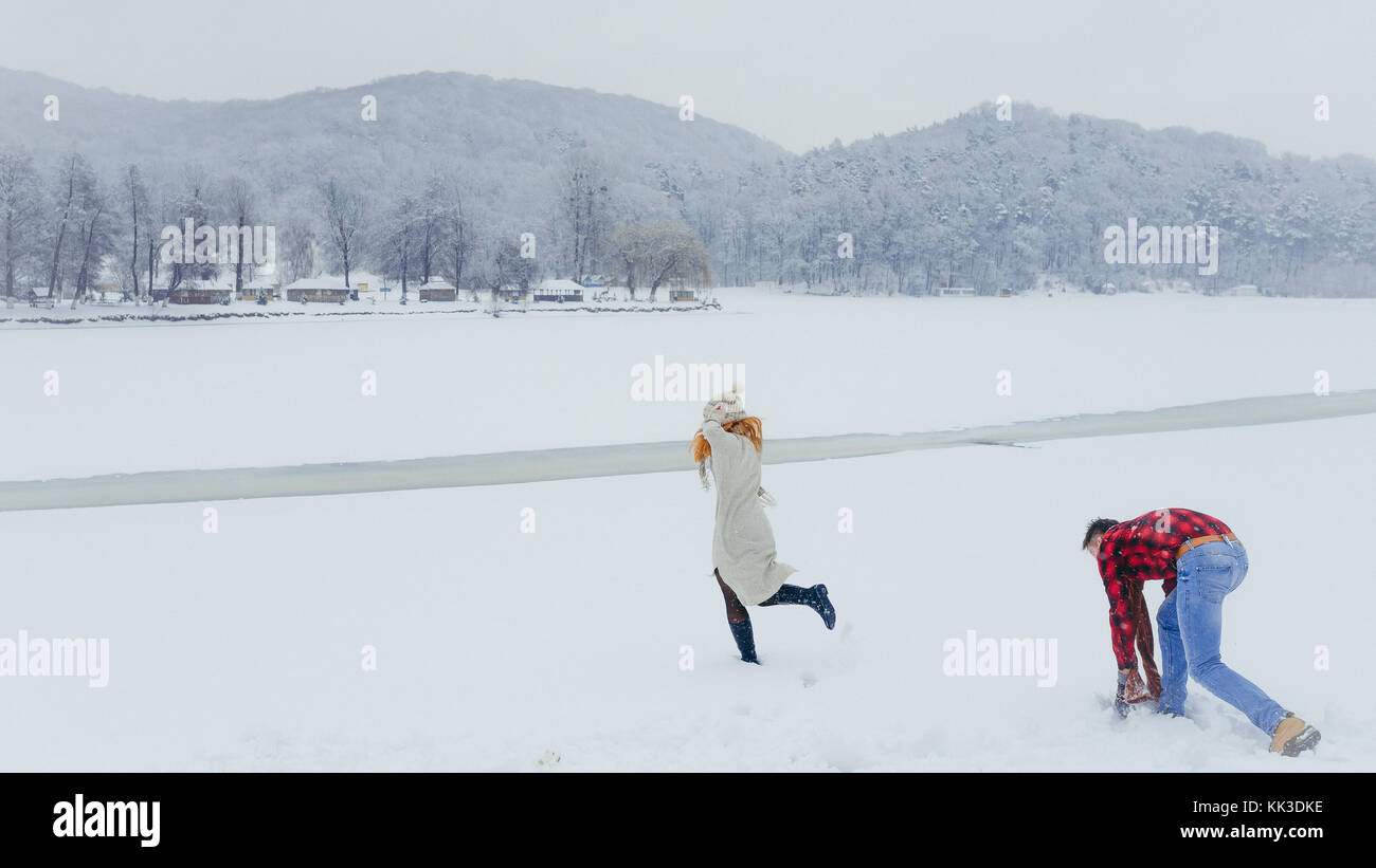 Man making snowball hi-res stock photography and images - Alamy