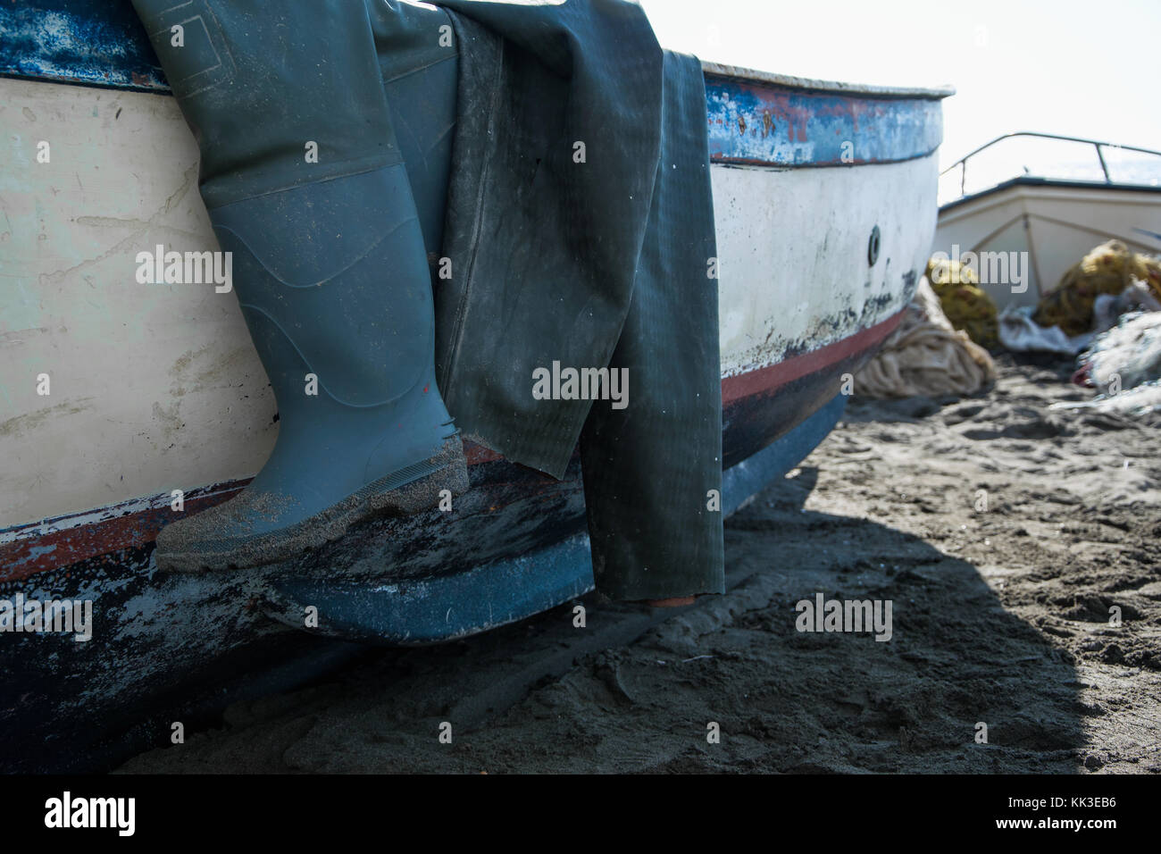 Fishing boots on the boat Stock Photo - Alamy