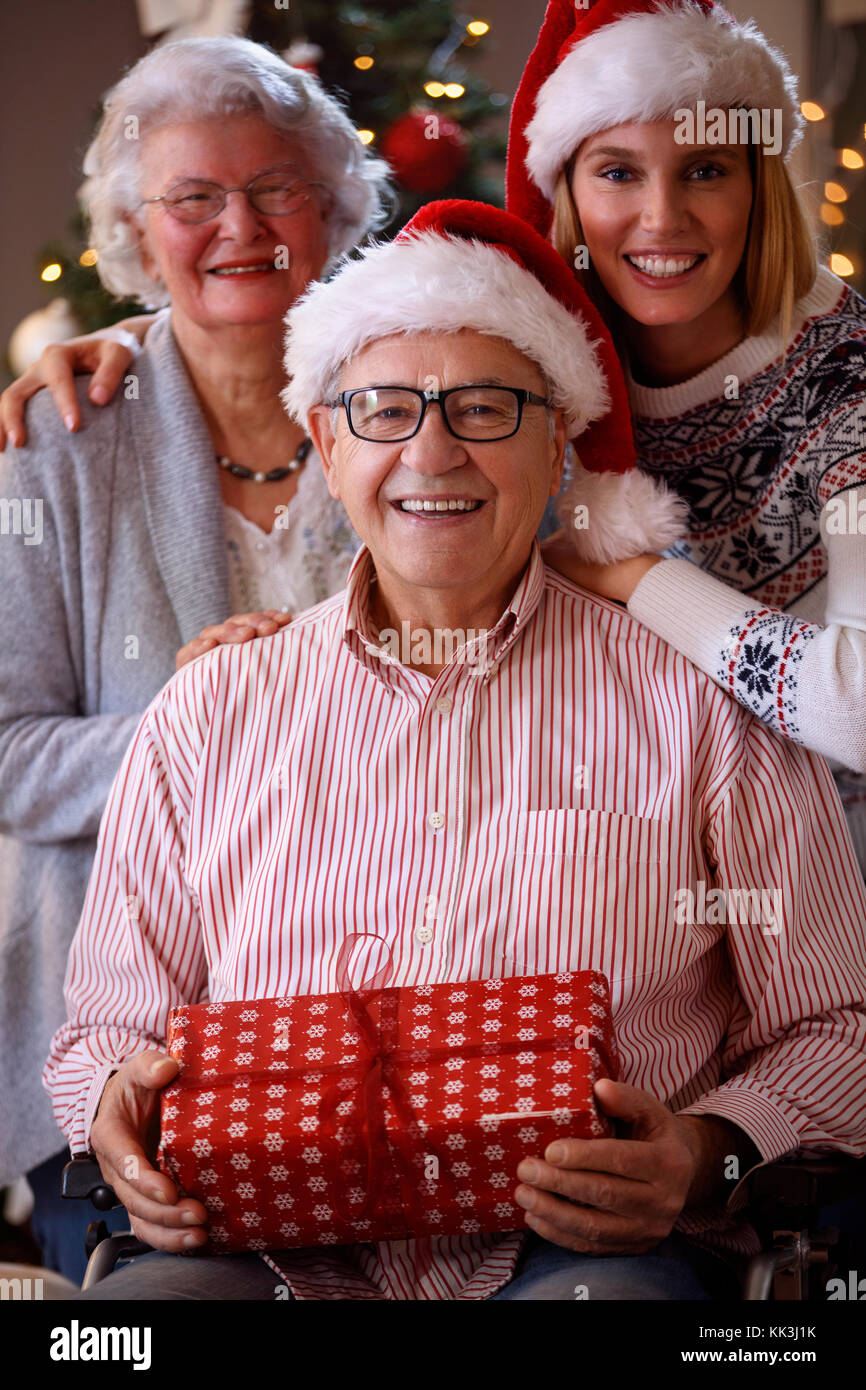 Christmas portrait - smiling family with wearing Santa caps Stock Photo ...