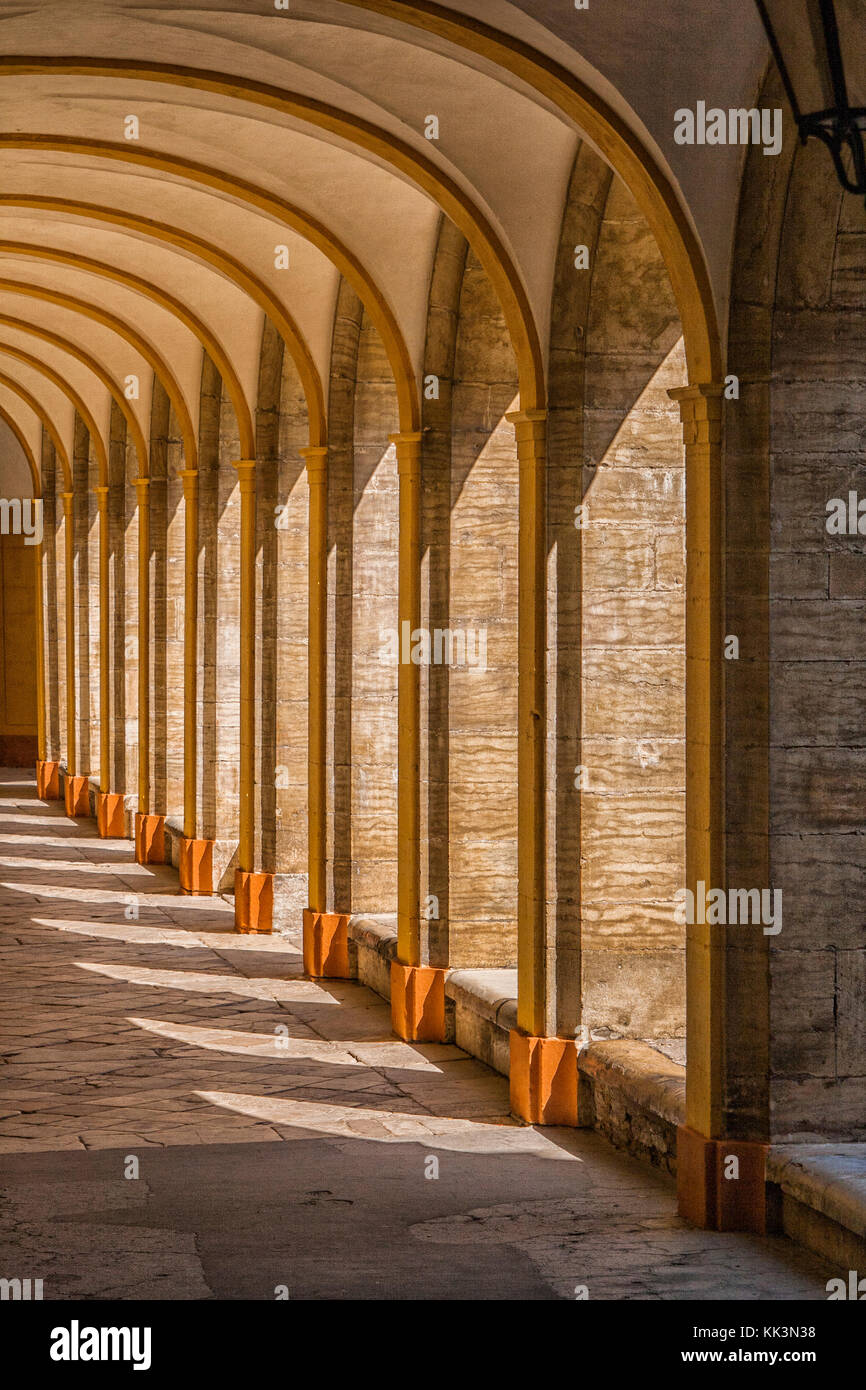 Sunlight through the arches of a corridor in a medieval cloister Stock ...