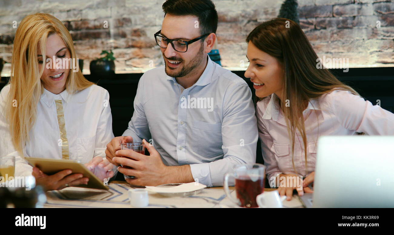 Happy colleagues casual chat at the office Stock Photo - Alamy