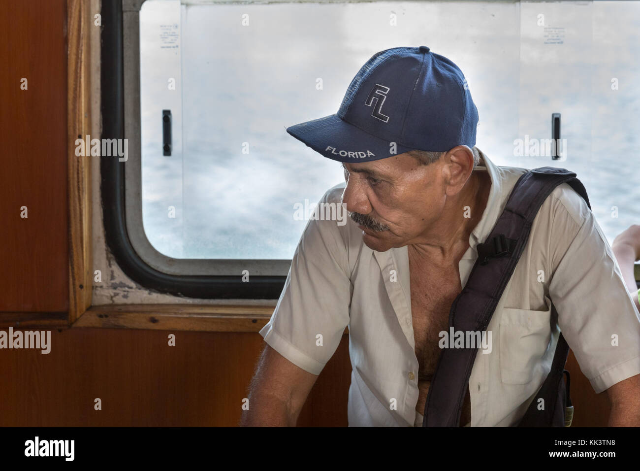 Cuban worker on his daily commute by local ferry service, Havana, Cuba ...
