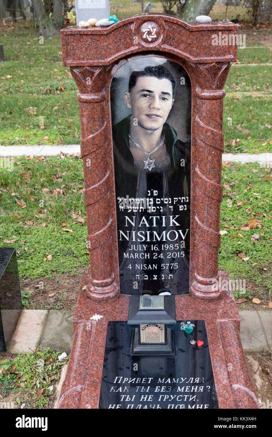 An ornate black granite tombstone with a diamond etched portrait at ...