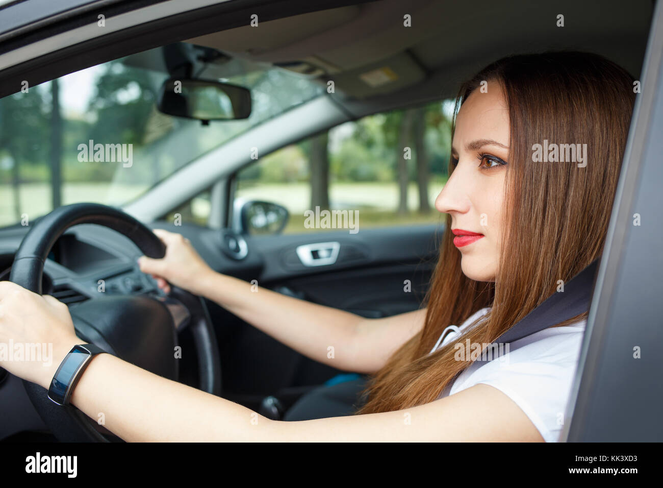 Young woman rent a car for travelling. Business woman sitting in a new ...