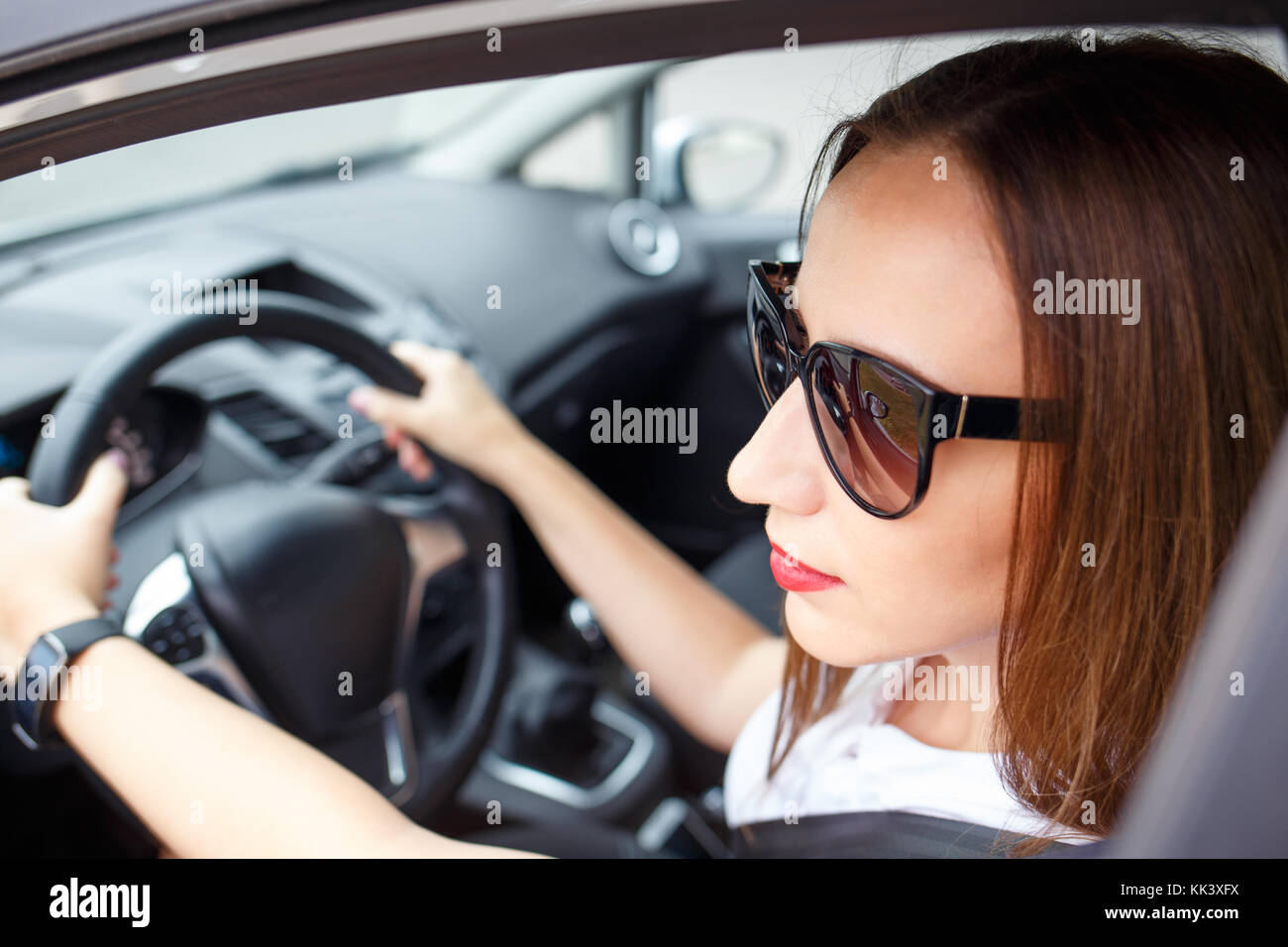 Young woman rent a car for travelling. Business woman sitting in a new ...