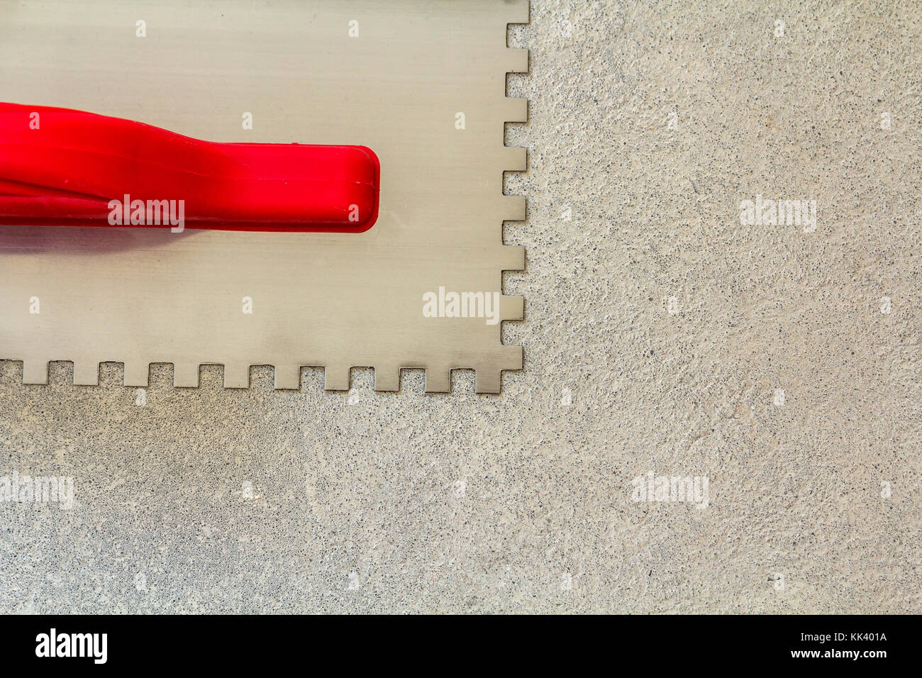 Construction notched trowel is a tool for tiles installation work Stock ...