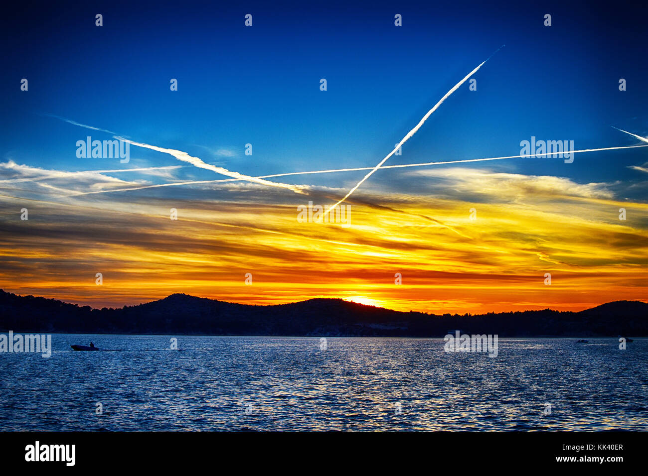 Sunset with plane contrails , Šibenik , Croatia Stock Photo - Alamy