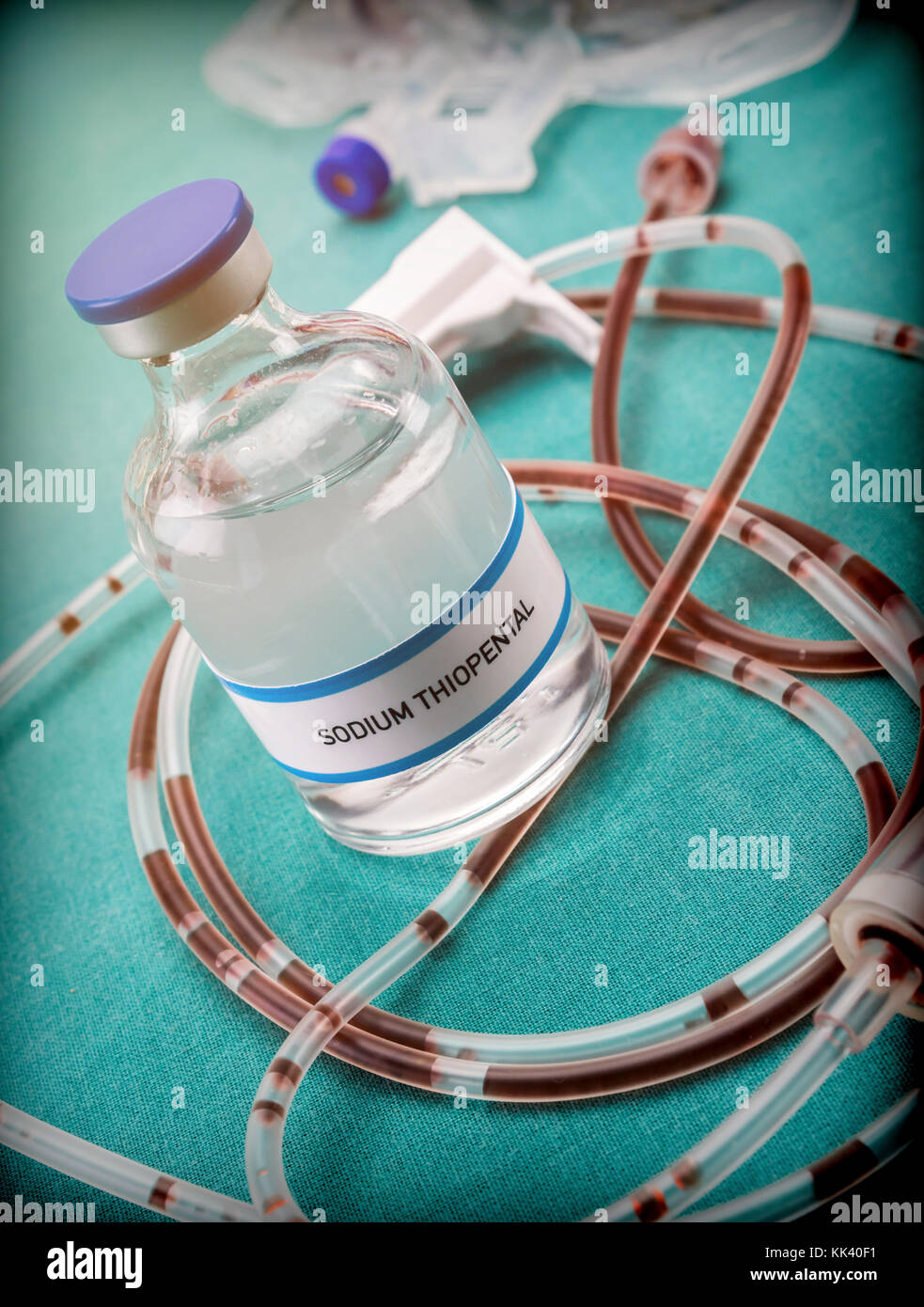 Rubber drip irrigation system with traces of blood along with vial of ...