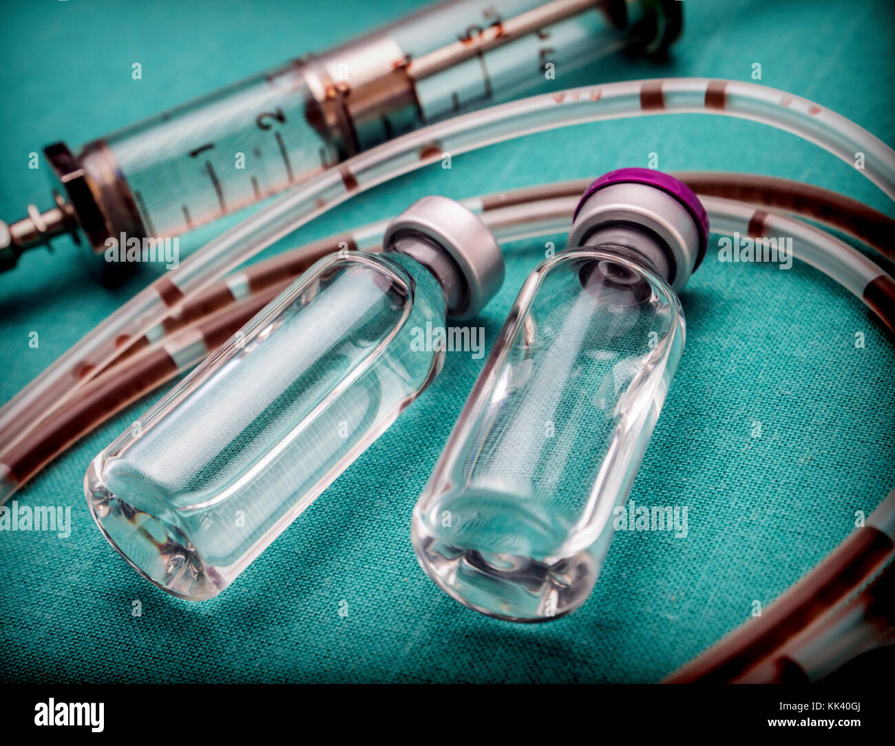 Rubber drip irrigation system with traces of blood along with vial ...