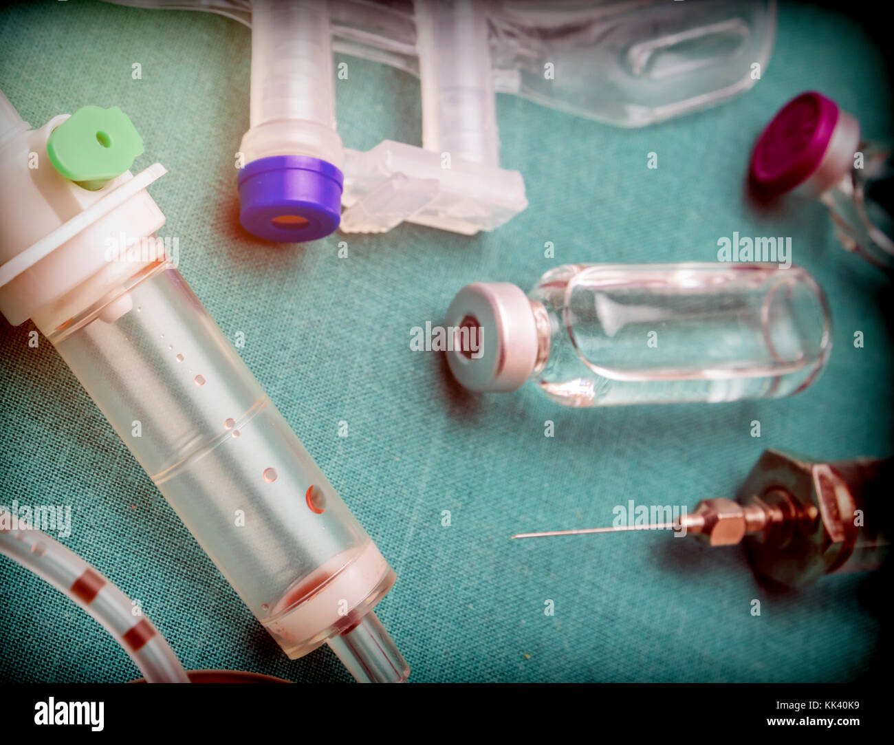 Vintage syringe next to drip irrigation equipment in a hospital ...