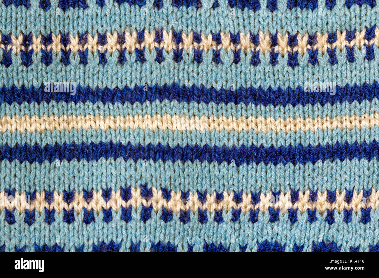 Background texture of blue pattern knitted fabric made of cotton or ...