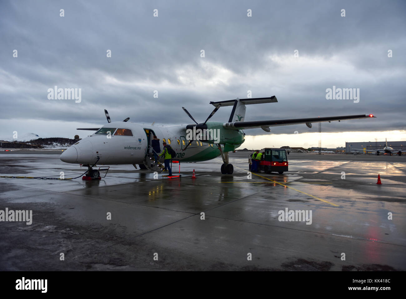 Bodo, Norway - February 19, 2016: Wideroe Airline Plane on the ground ... Bodo, Norway - February 19, 2016: Wideroe Airline Plane on the ground ...
