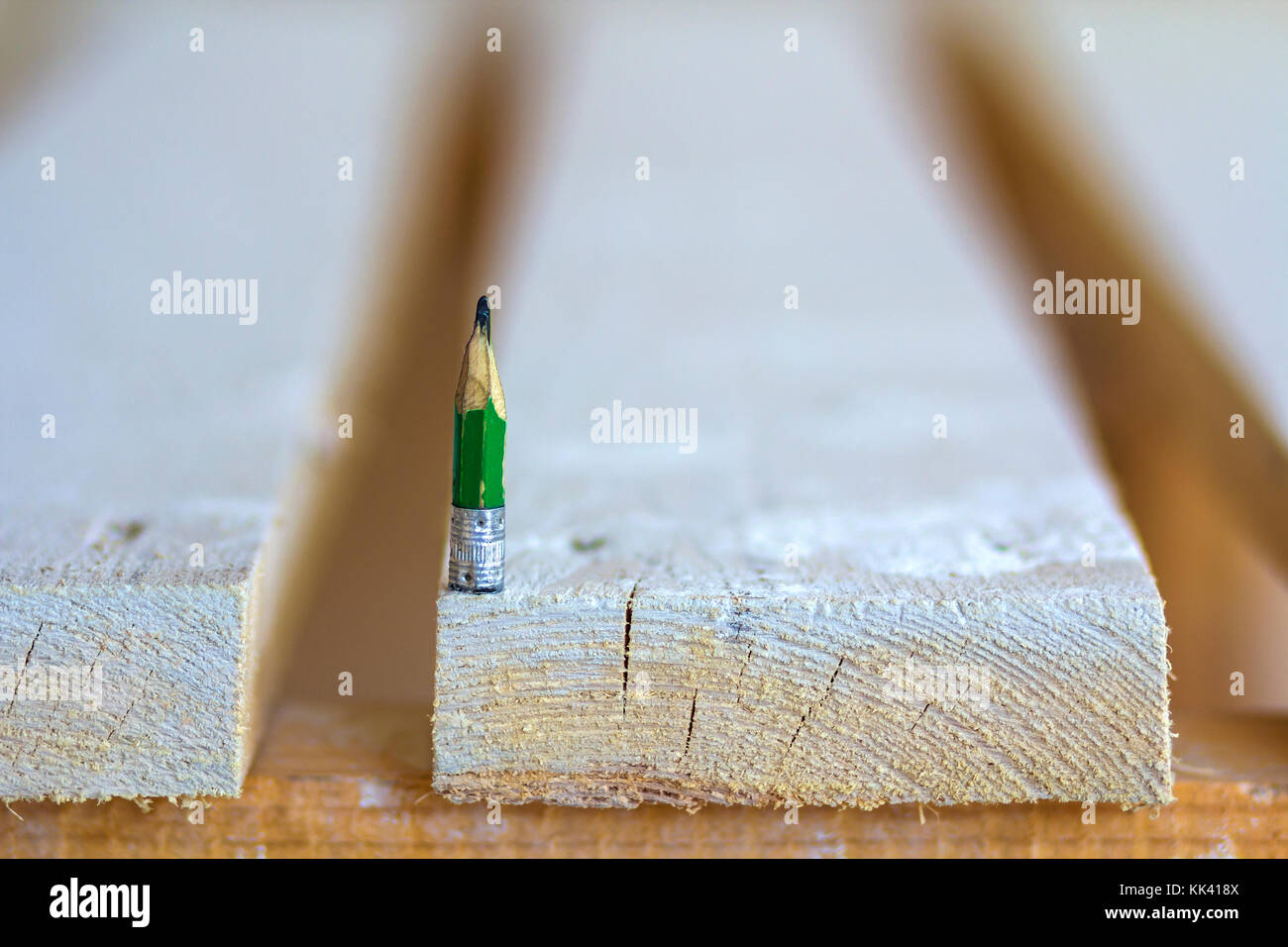 Wooden boards table top with one small pencil Stock Photo - Alamy
