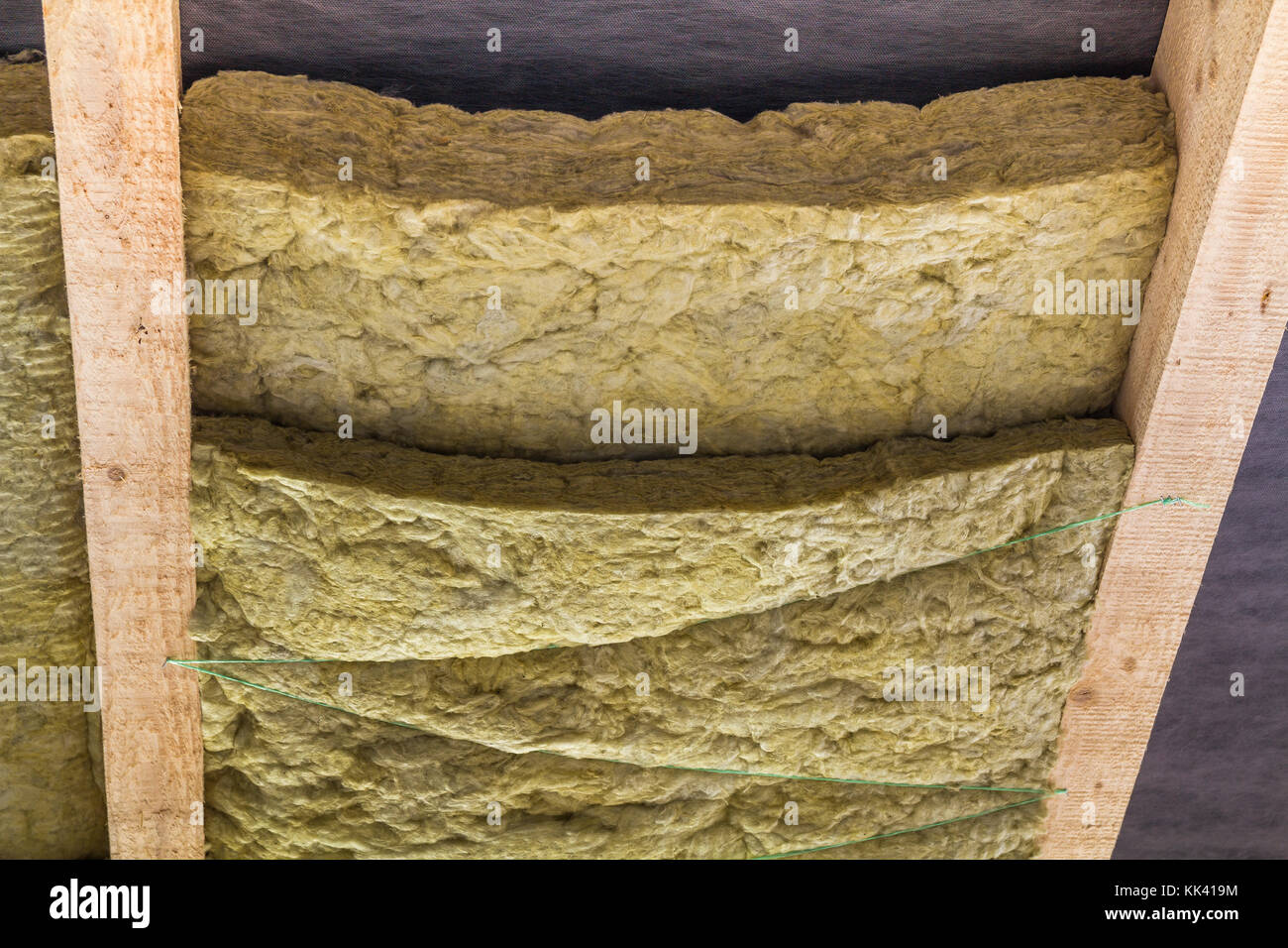 Thermal insulation mineral rock wool installation at the new building ...