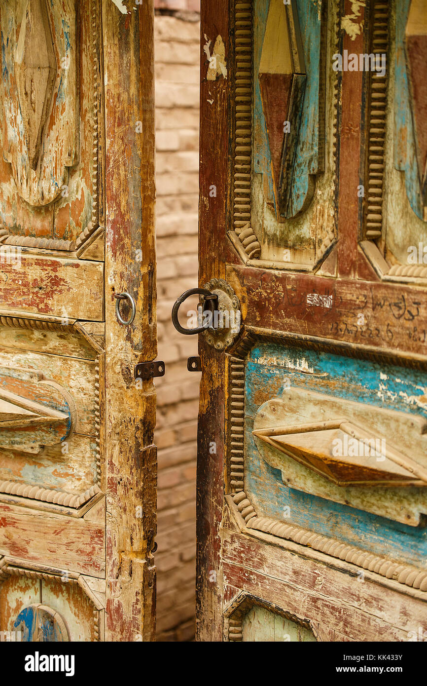 old polychrome muslim style wooden door open in the muslim district of ...