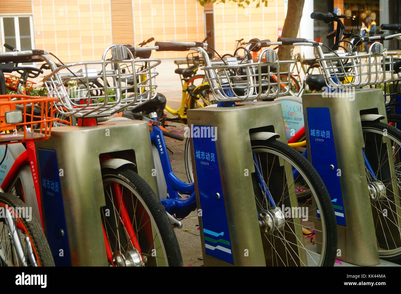 Public bike rental facilities and display of bicycle close-ups. In ...
