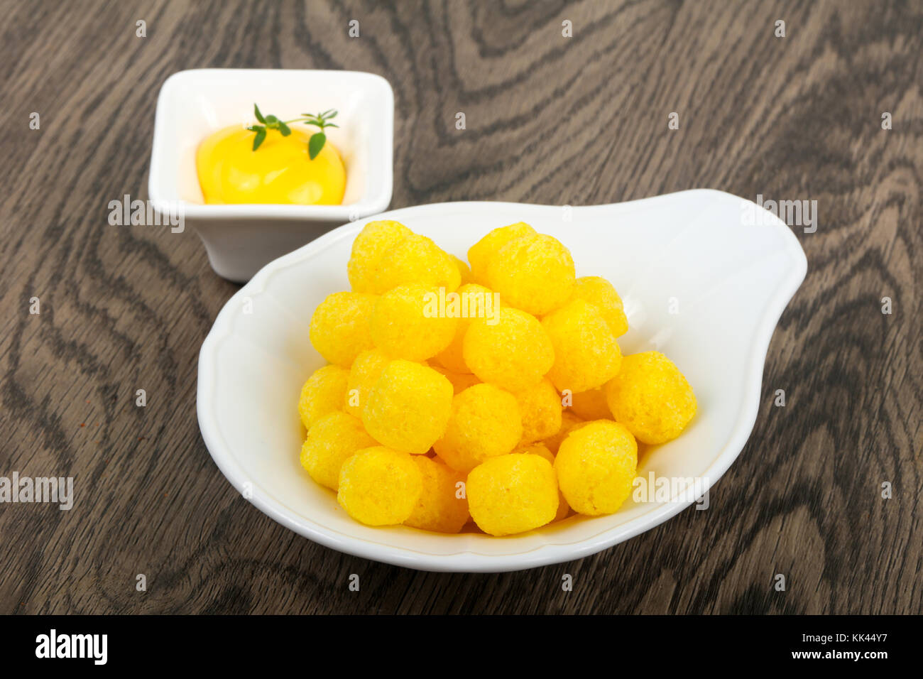 Cheese corn balls with sauce Stock Photo - Alamy