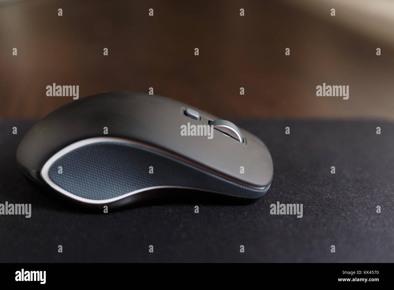 black computer mouse close-up on a black mat Stock Photo - Alamy