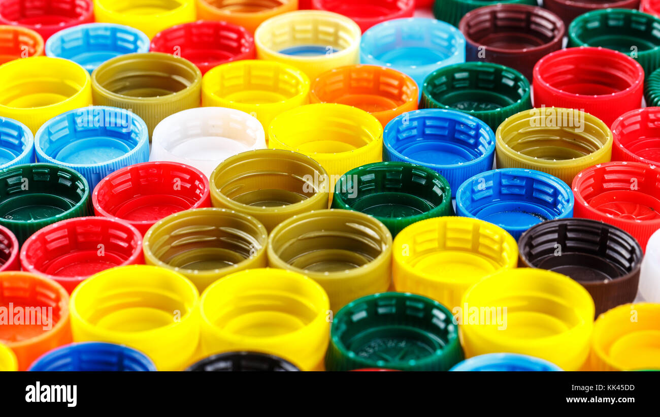 many plastic covers of different colors lined up in neat rows Stock ...