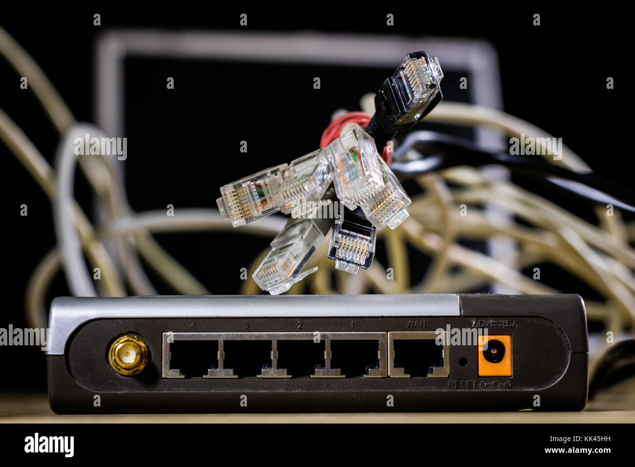 Network hub and rj45 cables on the stage. Computer accessories used in ...