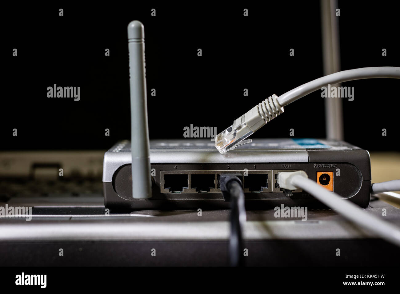 Network hub and rj45 cables on the stage. Computer accessories used in ...