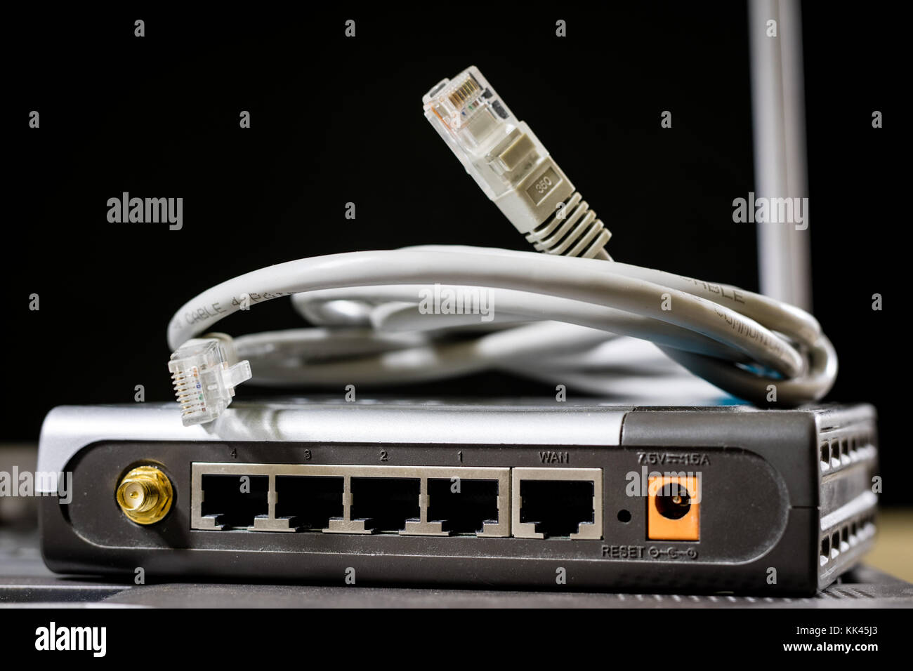 Network hub and rj45 cables on the stage. Computer accessories used in ...