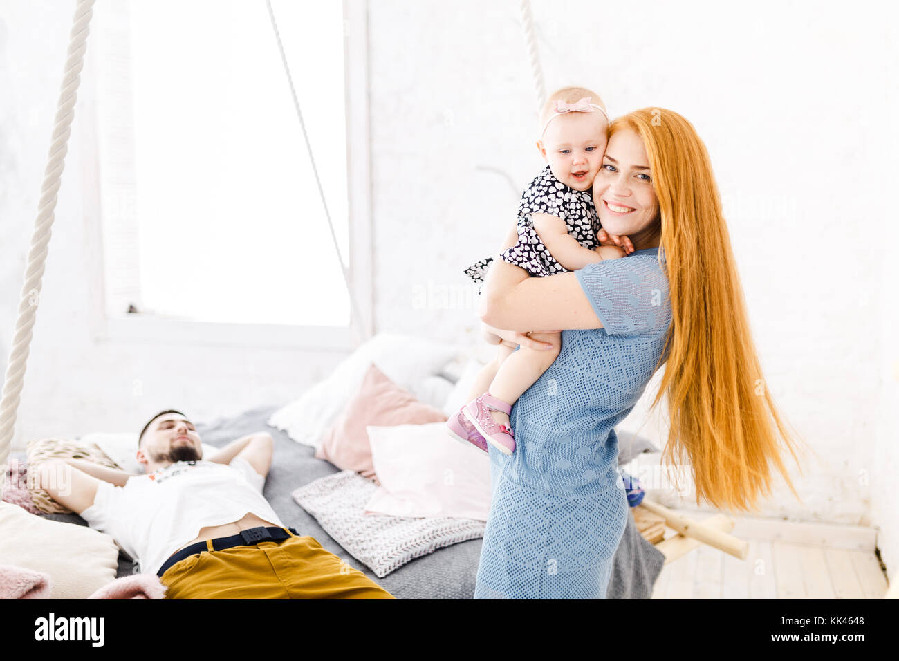 Family of three people sleeping in one bed hi-res stock photography and ...