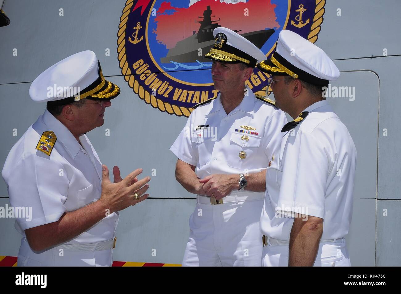 Turkish Naval Fleet Commander Admiral Nusret Guner, left, talks to ...