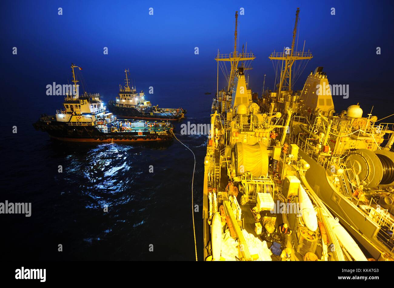 Tugboats pull the mine countermeasure ship USS Devastator MCM 6, left ...