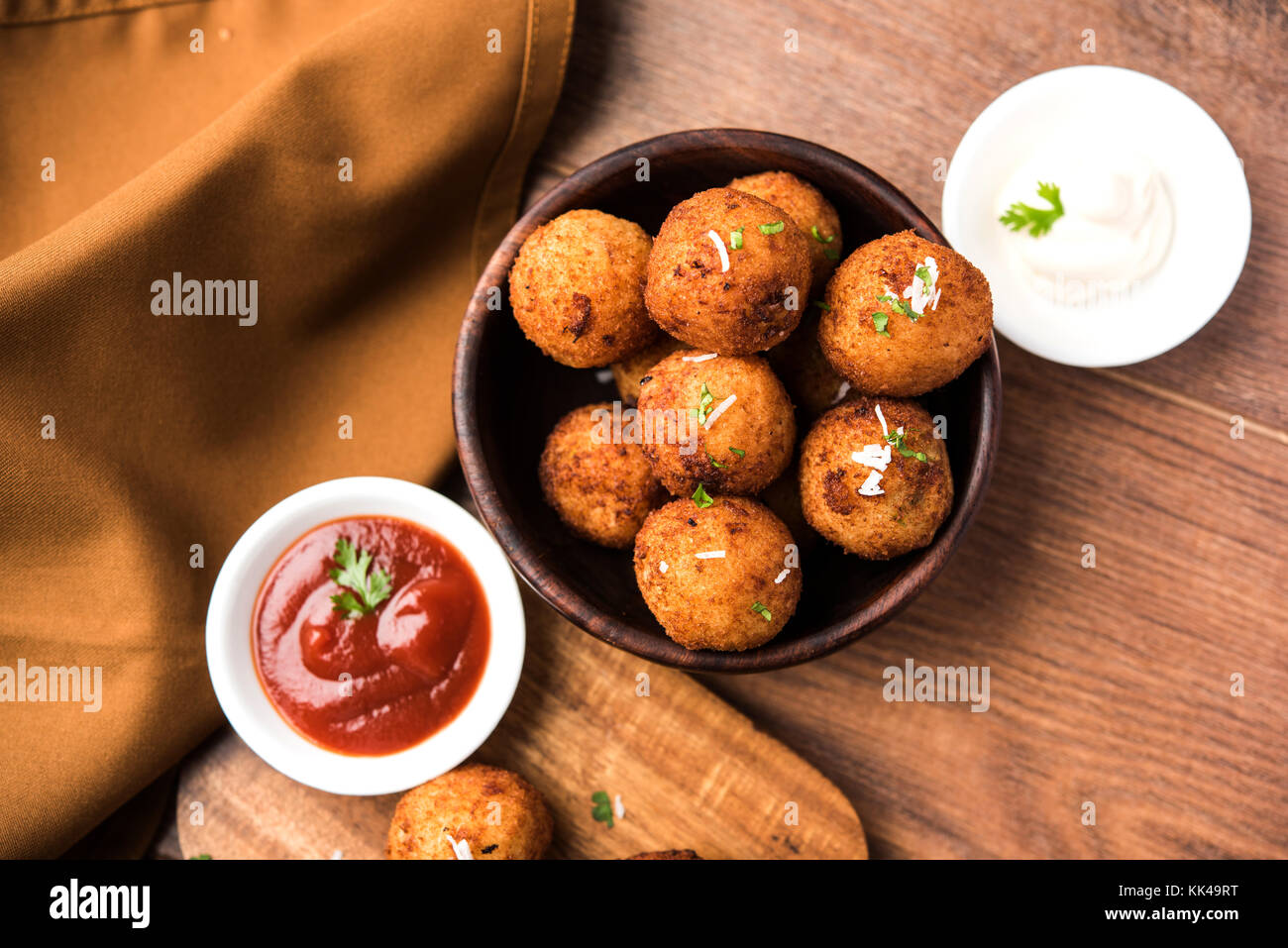 Fried potato cheese balls or croquettes with tomato ketchup. Selective ...