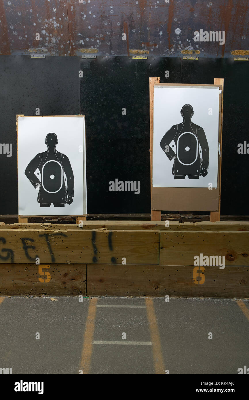 Two targets at an indoor shooting range for firearms practice and ...
