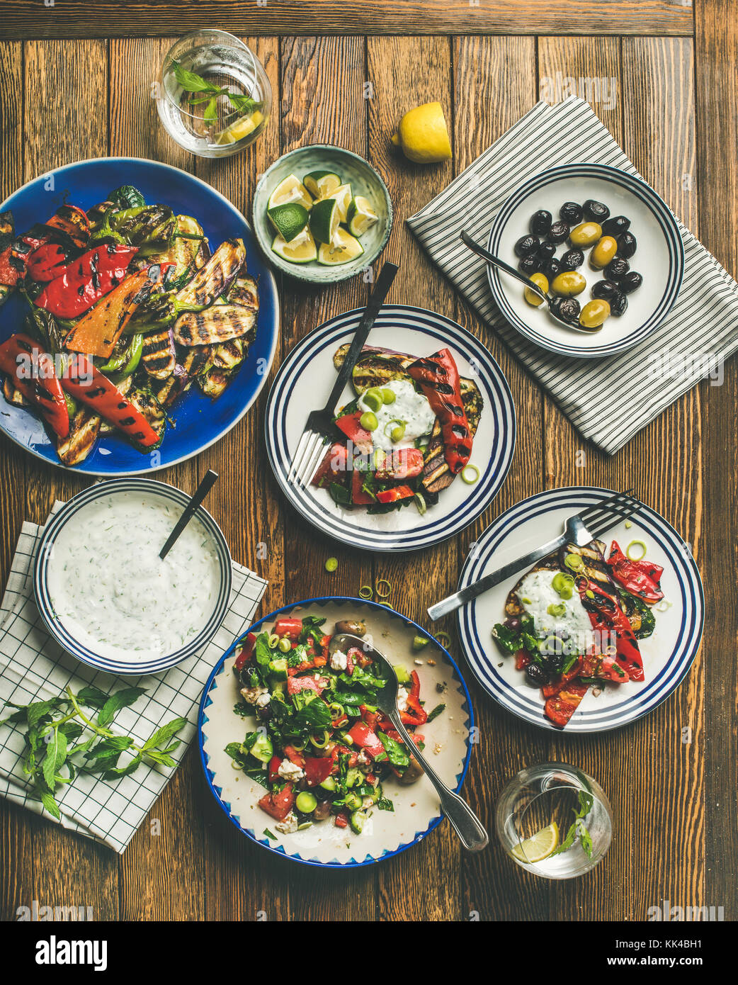 Flat-lay of healthy dinner table setting with snacks Stock Photo - Alamy