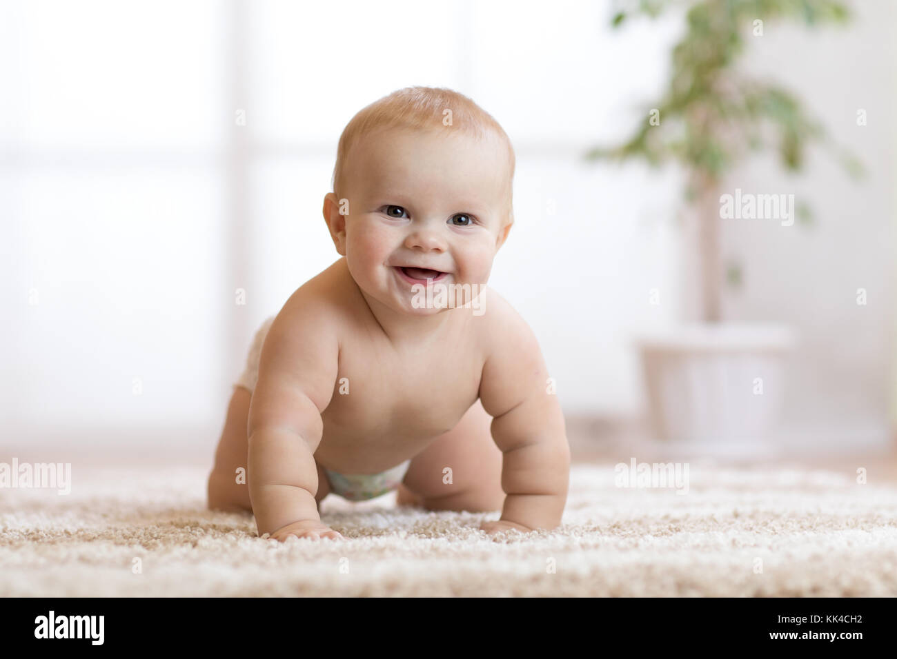 crawling baby boy at home on floor Stock Photo - Alamy