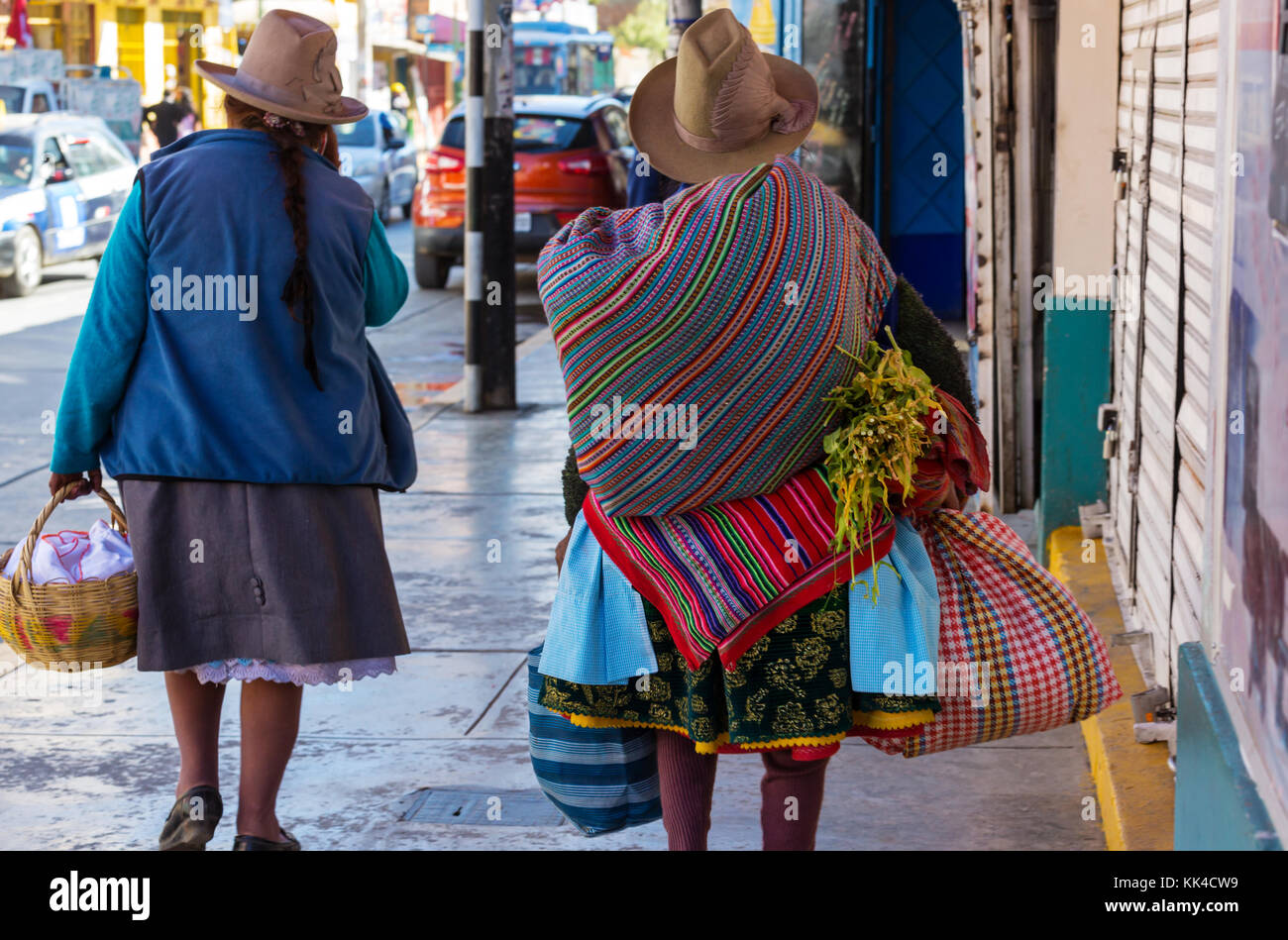 Peruvian people in city street Stock Photo - Alamy
