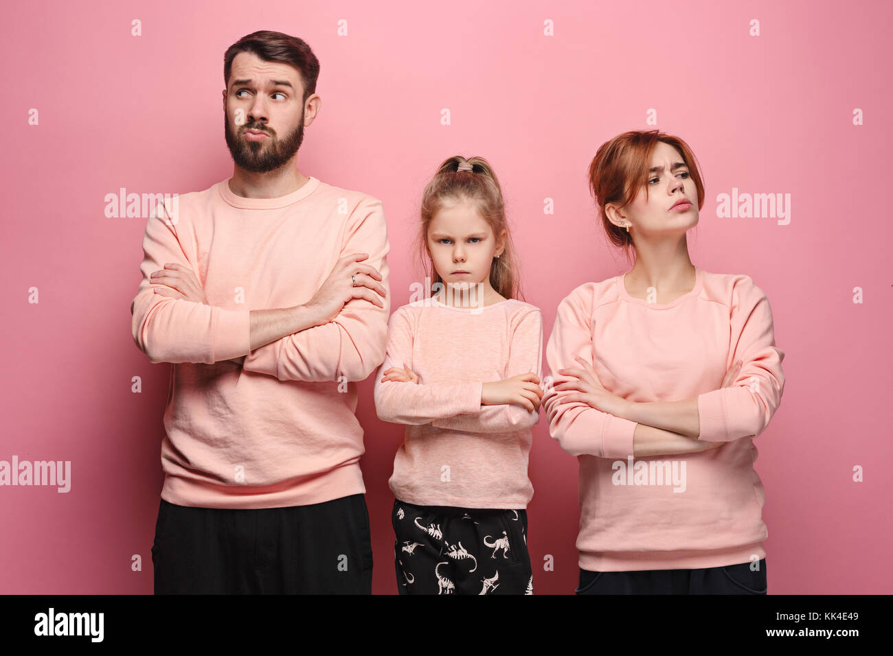 The sad family on pink Stock Photo - Alamy