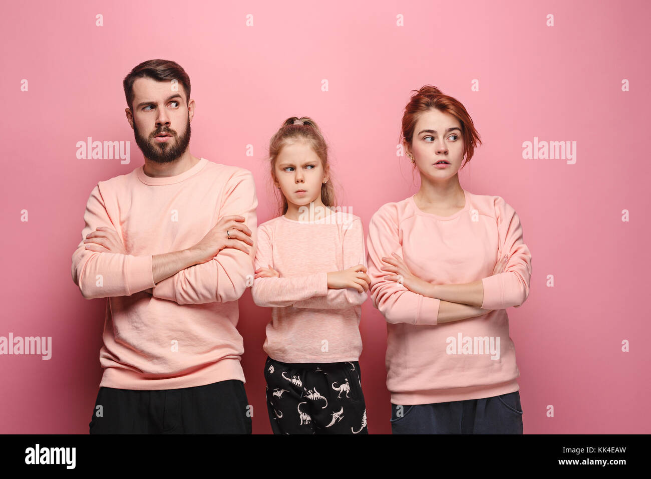 The sad family on pink Stock Photo - Alamy