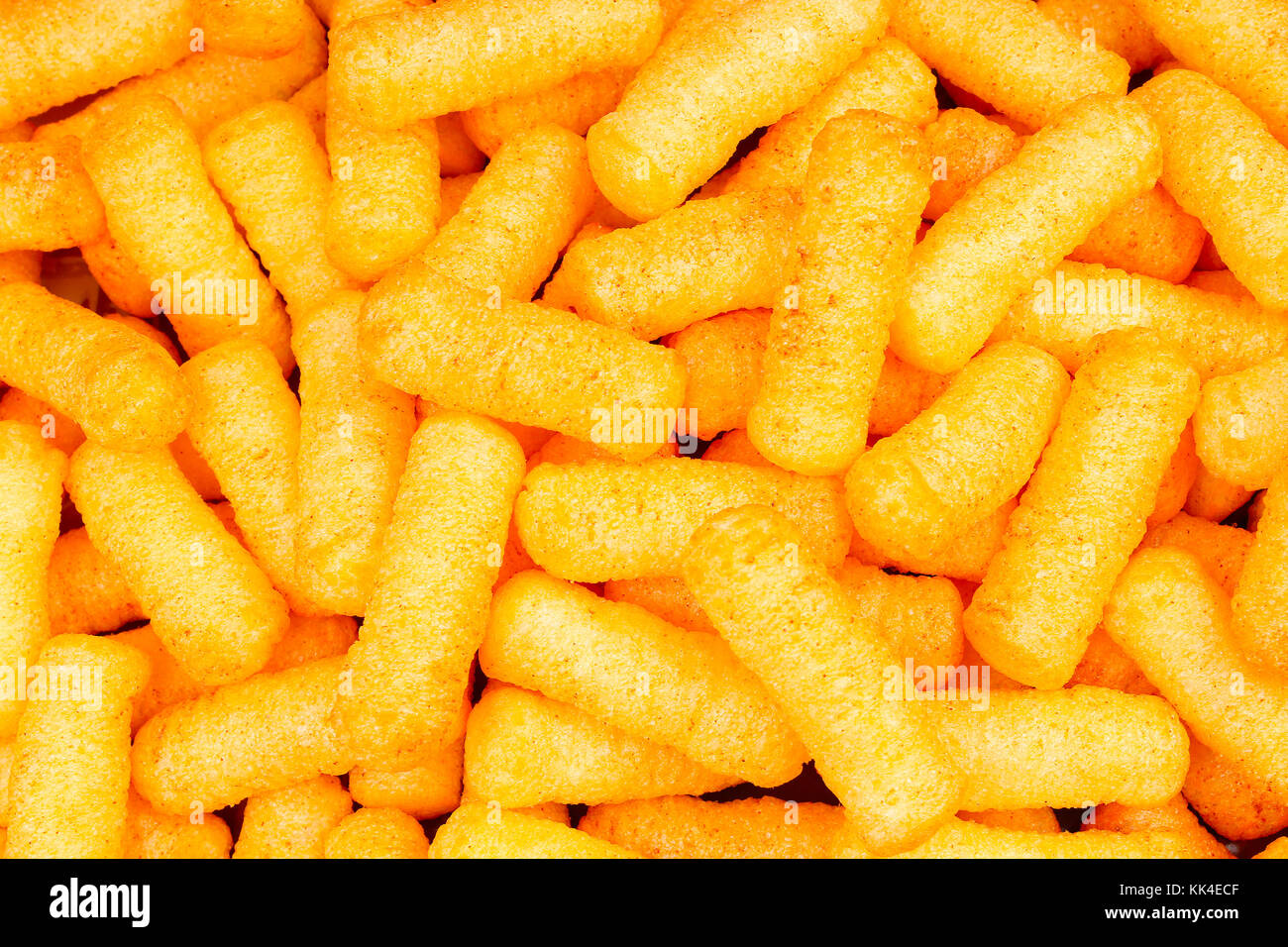 Cheese puff texture pattern background. Cheese puff snack snacks as ...
