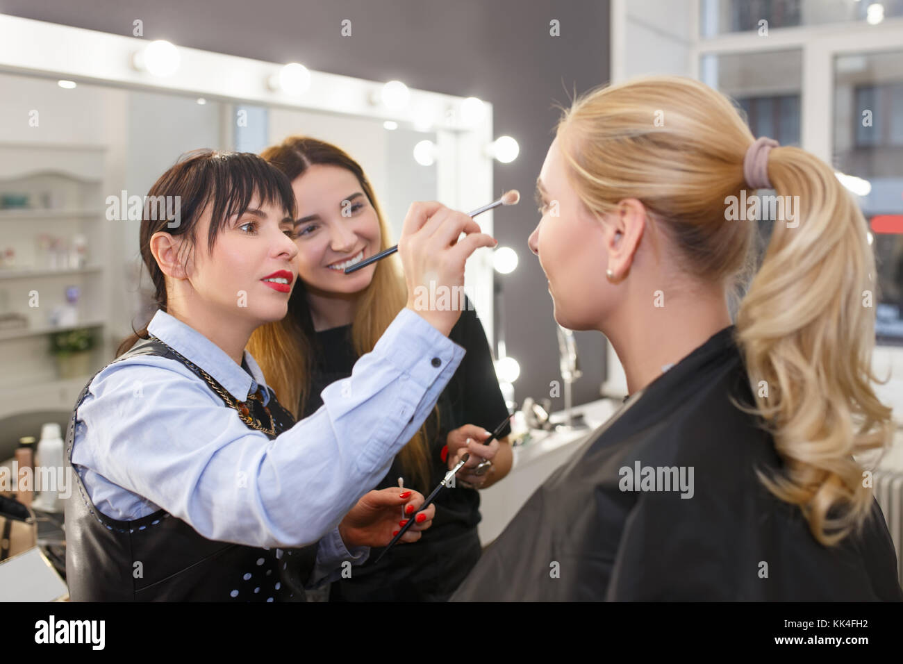 happy makeup teacher with her student girl. Makeup tutorial lesson at ...