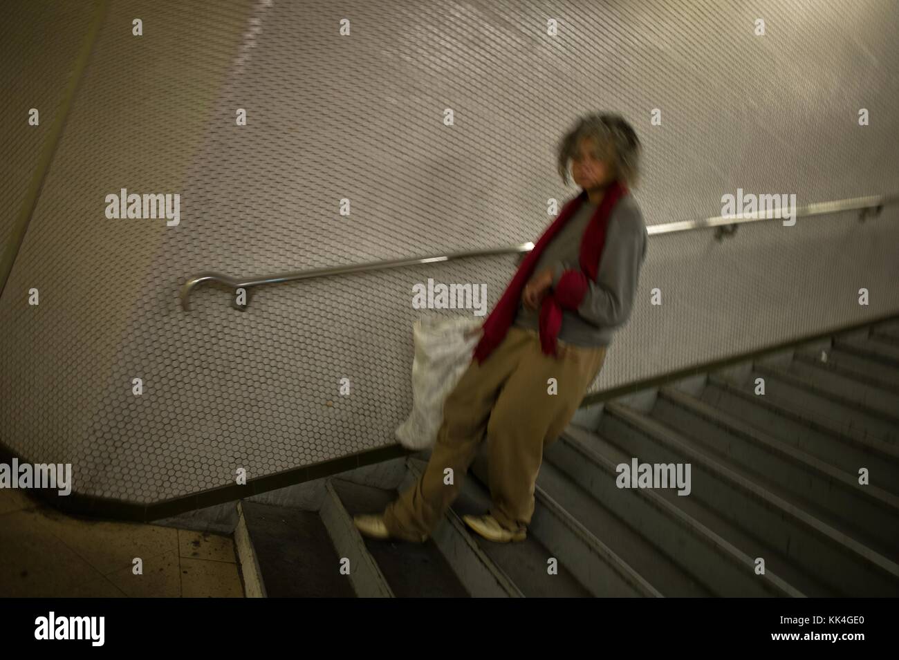 Urban Poverty - 12/07/2012 - - poor woman in the subway Gare de Lyon in ...