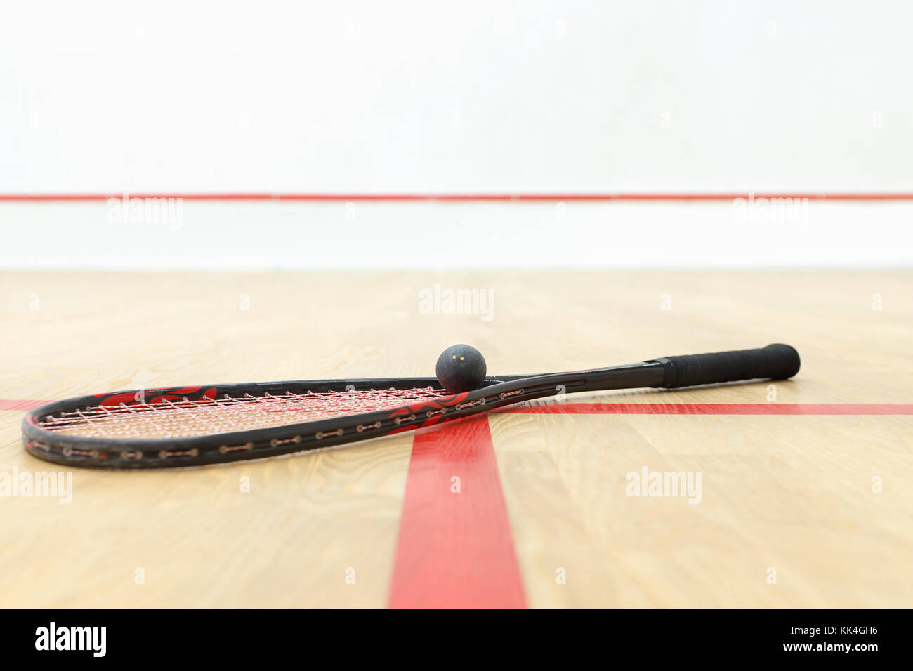 racquetball equipment and wall with red lines Stock Photo - Alamy