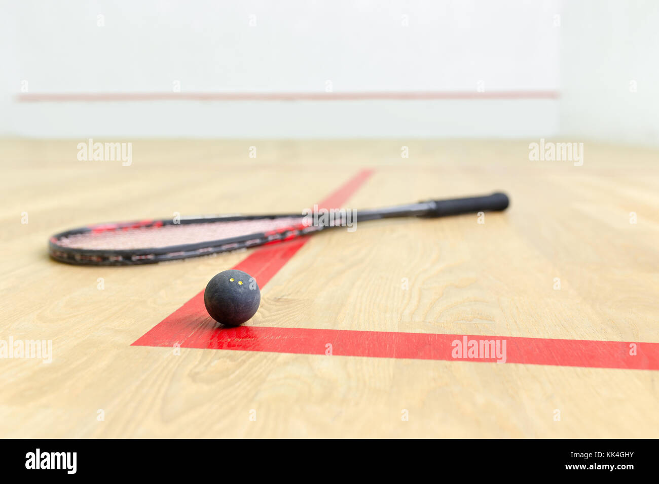 racquetball equipment and wall with red lines Stock Photo - Alamy