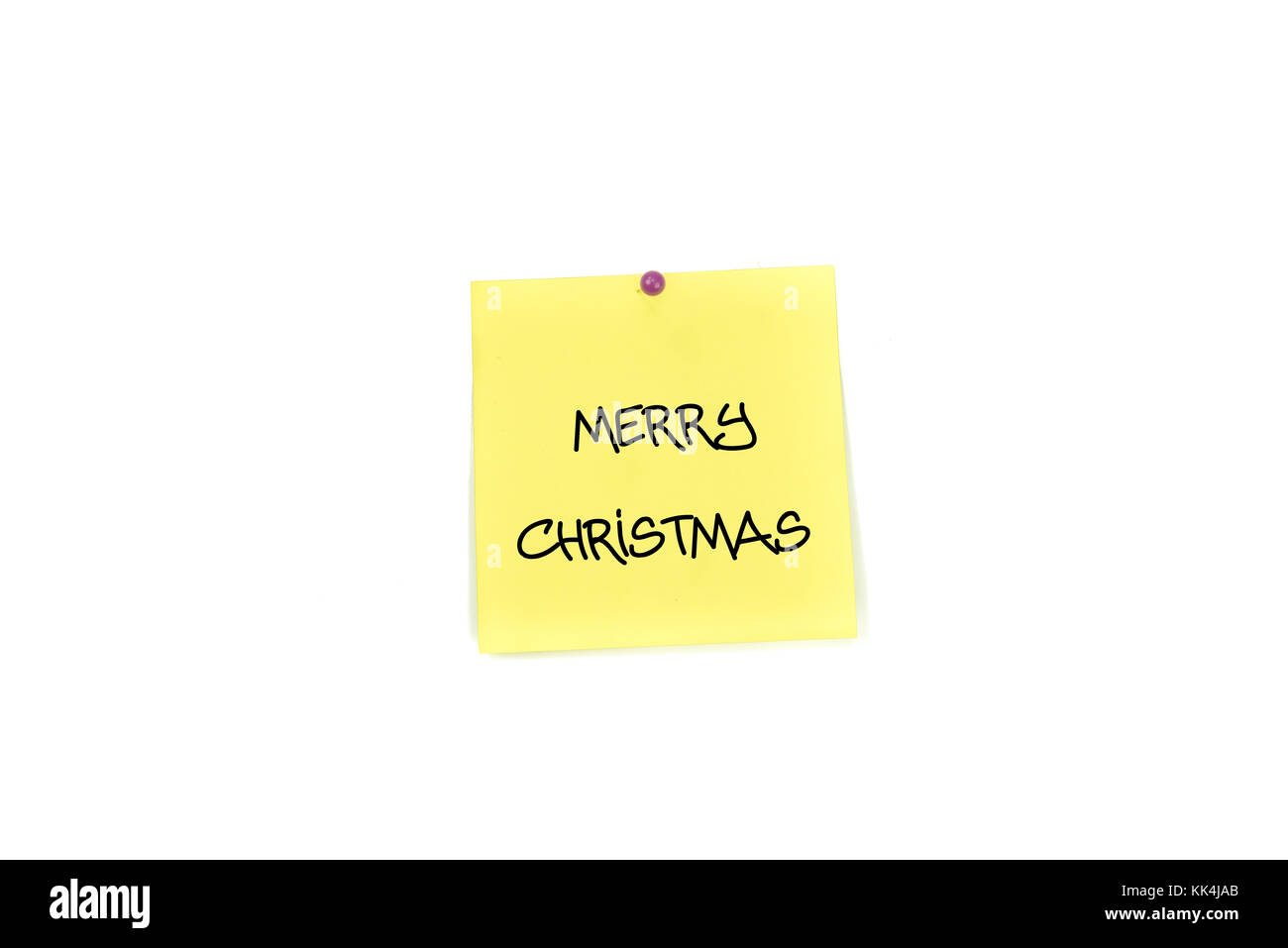 Yellow post it notes with pin : Merry Christmas Stock Photo - Alamy