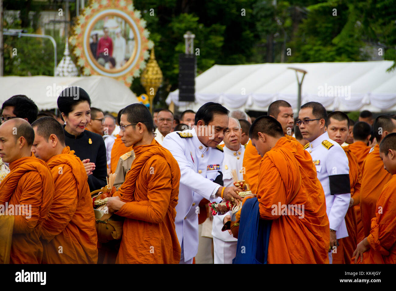 Thai Prime Minister Prayuth Chan-Ocha give alms to Buddhist monks ...