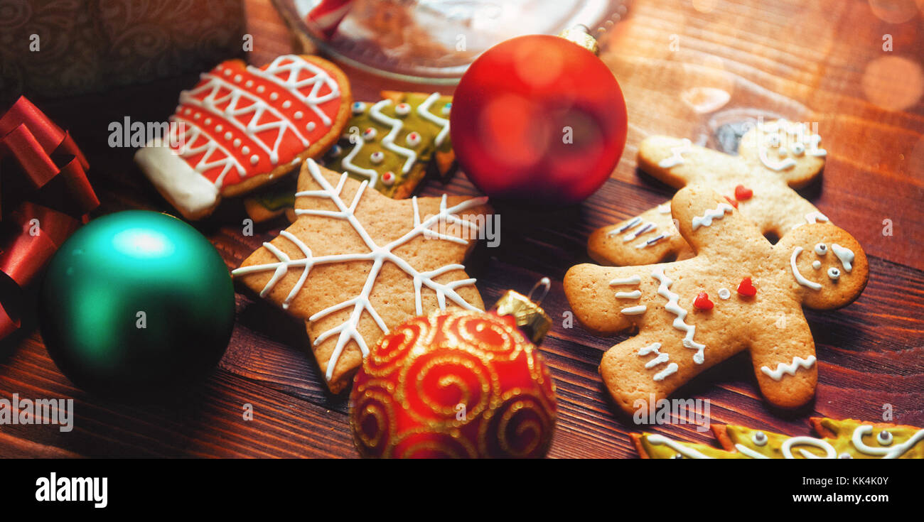 Christmas still life. homemade ginger biscuits, cane candy, on a wooden ...