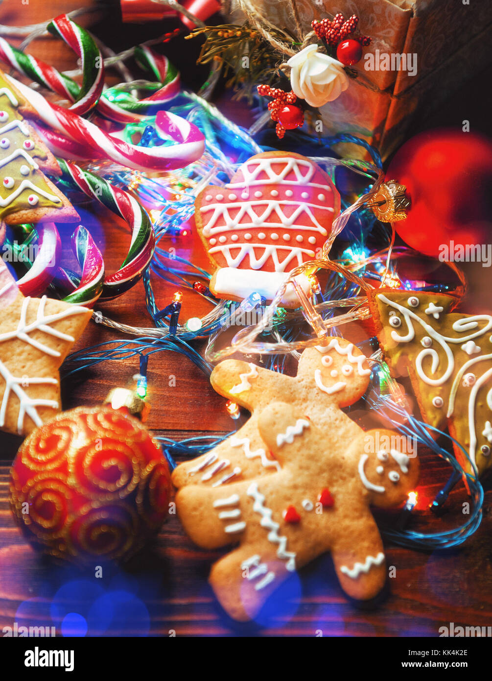 Christmas still life. homemade ginger biscuits, cane candy, on a wooden ...