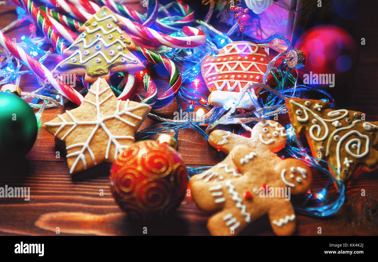 Christmas still life. homemade ginger biscuits, cane candy, on a wooden ...